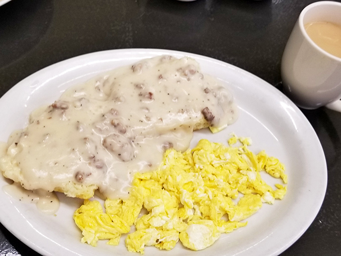 Biscuits smothered in creamy sausage gravy alongside fluffy scrambled eggs – the Alamo Breakfast doesn't remember defeat, only deliciousness.