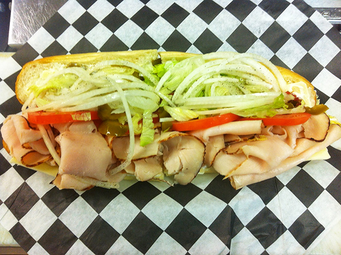 Behold the architectural marvel that is the American hoagie. Perfectly layered meats, crisp vegetables, and that ideal bread-to-filling ratio that engineers could study.