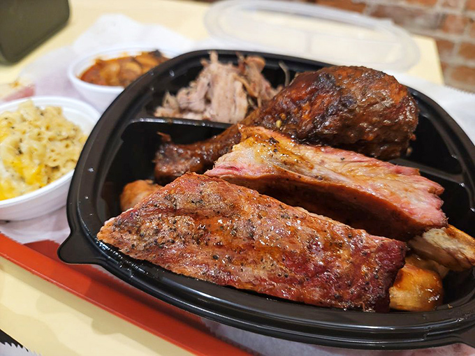 Behold the carnivore's dream team! These ribs showcase that perfect pink smoke ring—nature's way of telling you someone really knows what they're doing.