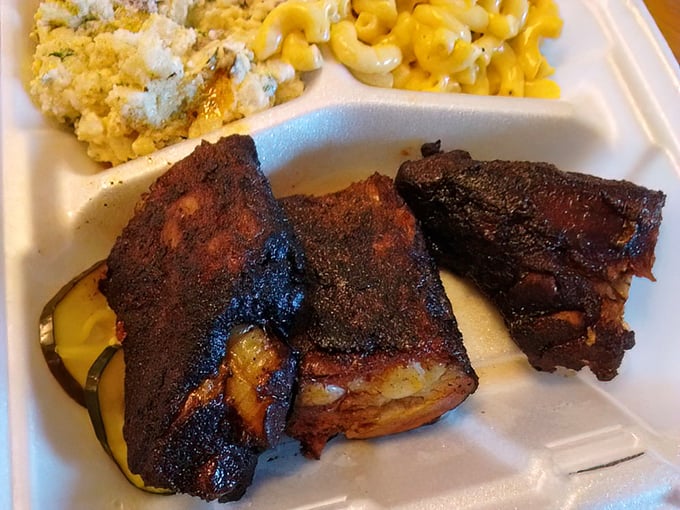 These ribs don't just fall off the bone—they practically leap with joy, bringing along that perfect smoke ring as evidence of low-and-slow dedication.