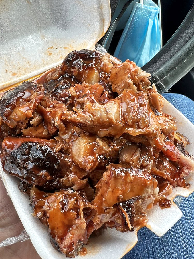 Glistening with sauce and sporting that telltale smoke ring, these ribs aren't just food—they're edible evidence that patience is indeed a virtue.