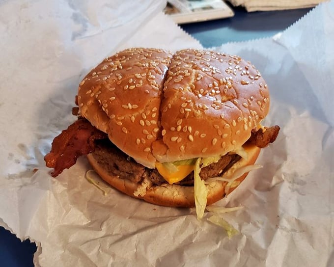Behold the star of the show—a bacon cheeseburger that doesn't need filters or fancy plating. Just perfectly melted cheese, crispy bacon, and beef cooked with respect.