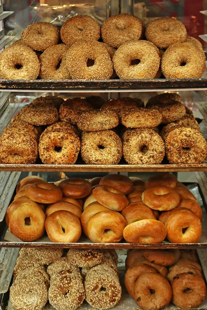 Bagel perfection in four glorious varieties. Notice how they're lined up like edible Olympic medals – each one a champion in its own right.
