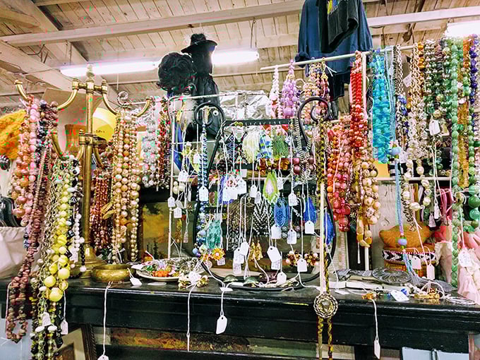 A jewelry lover's fever dream—beads and necklaces cascade like colorful waterfalls, each strand carrying whispers of past celebrations and forgotten nights out.