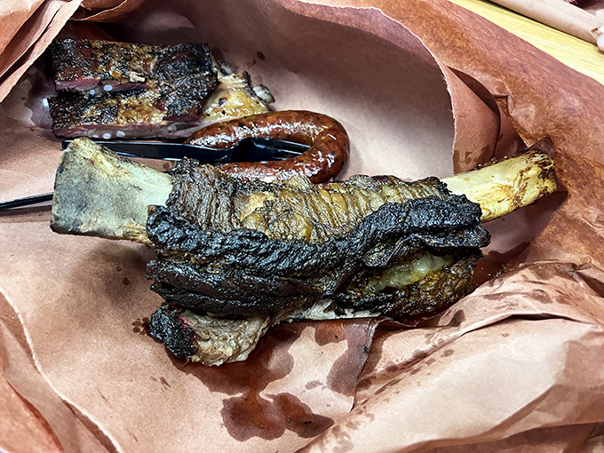 Behold the beef rib—a prehistoric-looking masterpiece with bark so perfect it should be in a museum of carnivorous delights.