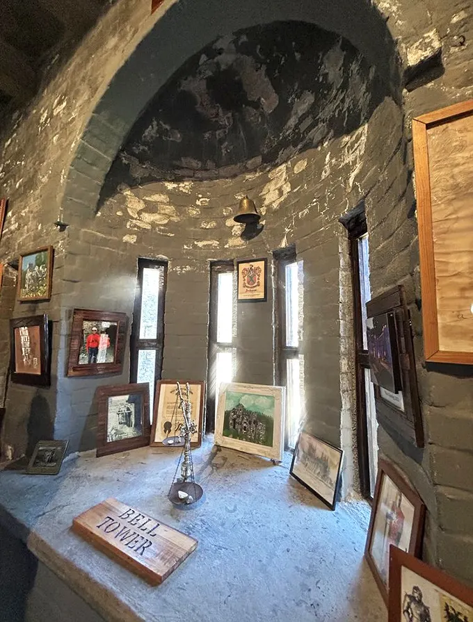 This arched nook houses more than just a bell—it's a time capsule of castle culture complete with vintage photographs and handwritten history.