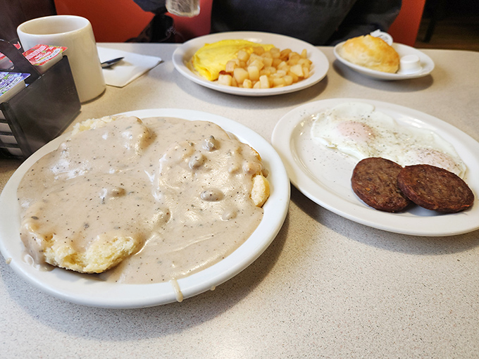 Biscuits drowning in creamy, pepper-flecked gravy—a breakfast so comforting it should come with a warning: "May induce involuntary sighs of contentment."