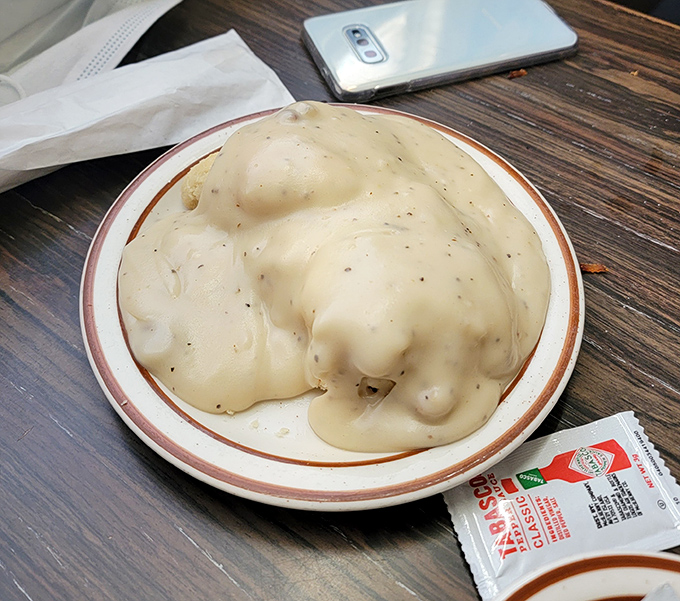 Behold the legendary biscuits and gravy—a cloud-like biscuit swimming in peppery, sausage-studded gravy that might just be worth the entire desert drive.