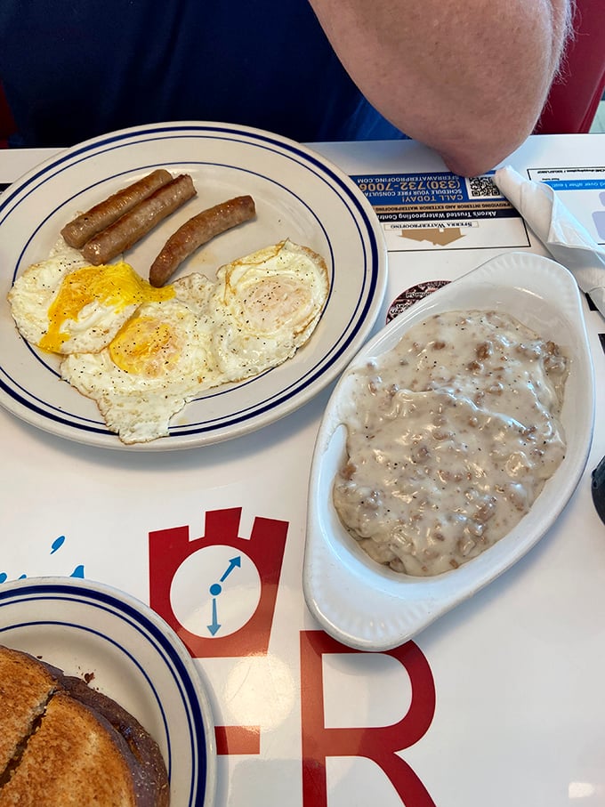 Sunny-side up eggs and sausage links share the spotlight with creamy biscuits and gravy—a breakfast duet that hits all the right notes.