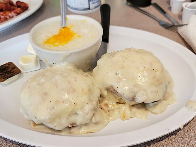 Behold the star attraction: biscuits and gravy that could make a grown Floridian weep with joy. That creamy blanket of gravy isn't just food—it's therapy.