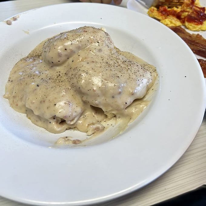 Biscuits and gravy so decadent they should come with a permission slip from your cardiologist. Worth every heavenly, peppery bite.