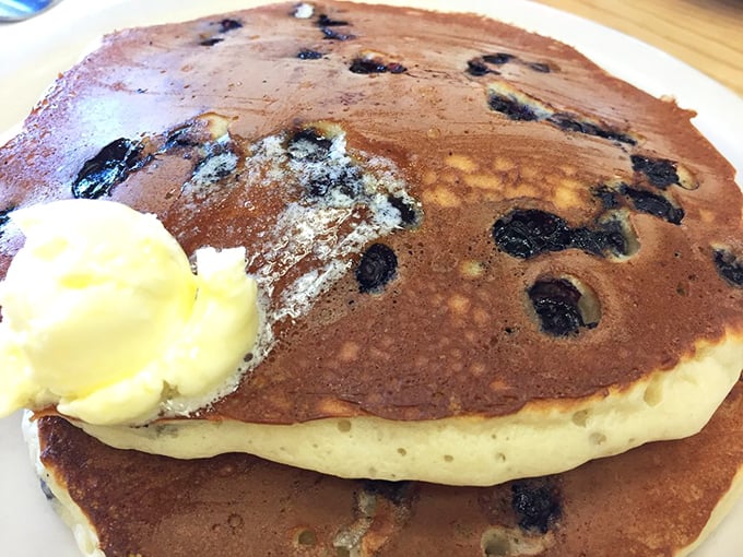 Blueberry pancakes that could make a grown adult weep with joy. Each berry bursts with flavor in this fluffy masterpiece.