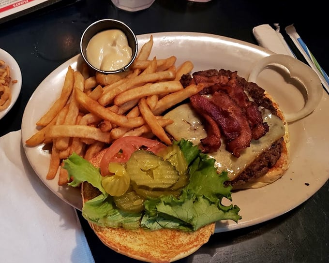This isn't just a burger—it's architecture with bacon. The perfect stack of beef, cheese, and crispy goodness that makes diets weep.