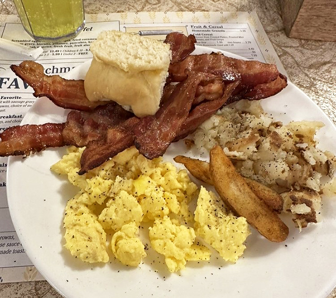 Breakfast perfection on a plate: eggs that actually taste like eggs, bacon with the ideal crisp-to-chew ratio, and potatoes that could make a carb-counter weep with joy. 