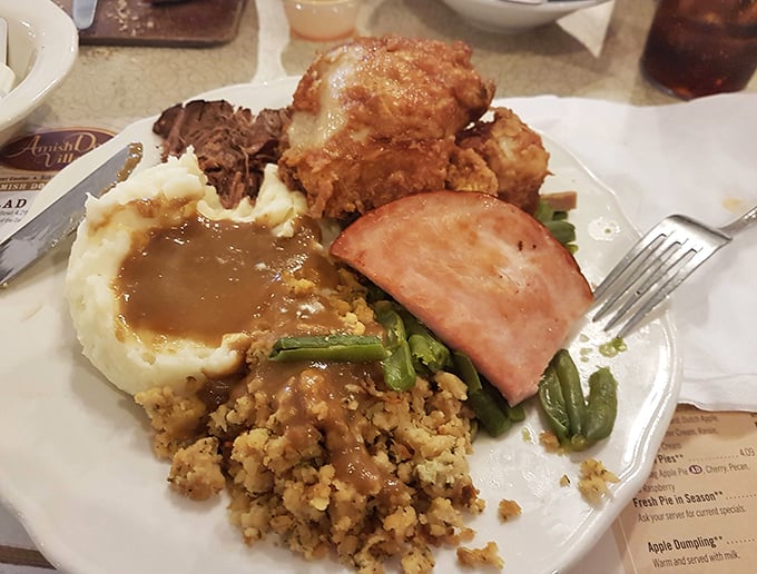 A plate that tells the story of Amish Country in one glorious arrangement. That stuffing alone would make a vegetarian consider changing teams.