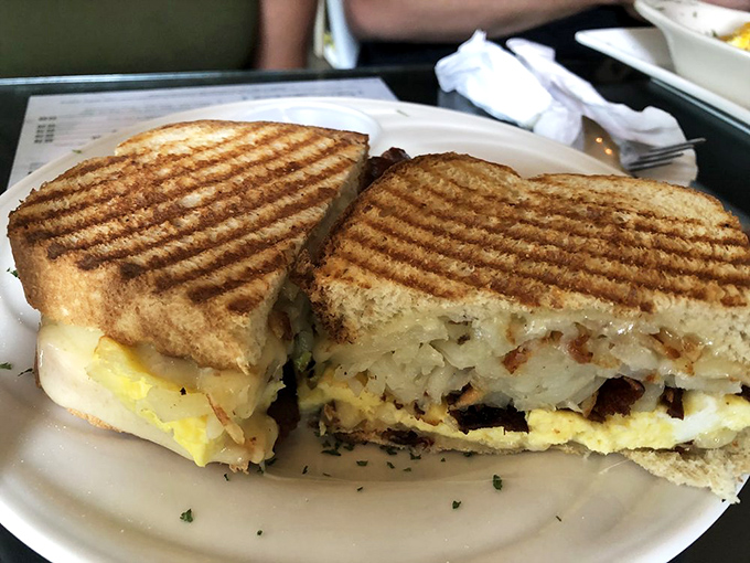 Breakfast panini perfection – where golden-grilled bread meets fluffy eggs in a morning romance that puts ordinary breakfast sandwiches to shame.