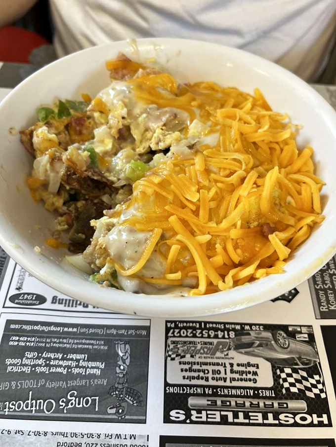 Breakfast alchemy at its finest – eggs, potatoes, and cheese coming together in a bowl that makes you question why anyone would ever skip the most important meal.