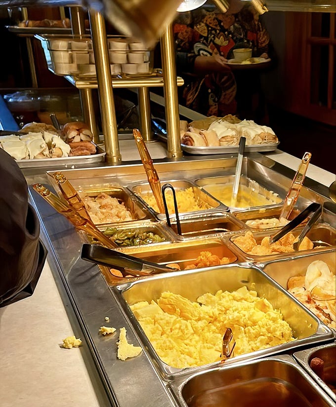 Behold the breakfast buffet in all its glory! Those scrambled eggs look fluffier than the clouds over Ohio on a spring morning.