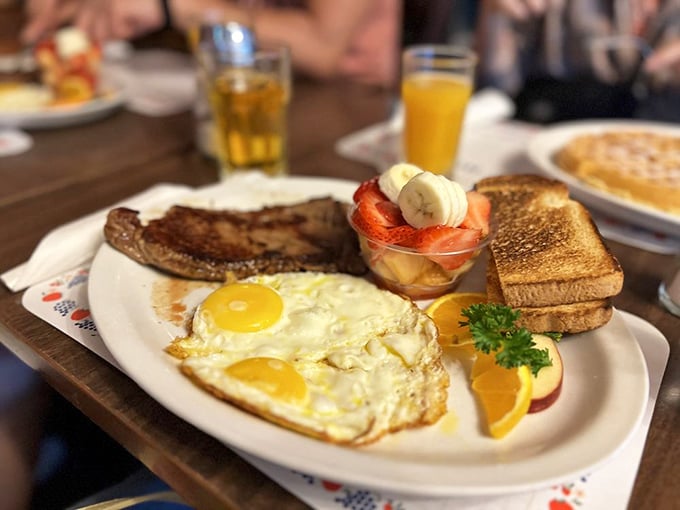 Breakfast perfection doesn't need fancy tricks—just perfectly cooked eggs, crisp toast, and a fruit cup that actually looks like someone cares.