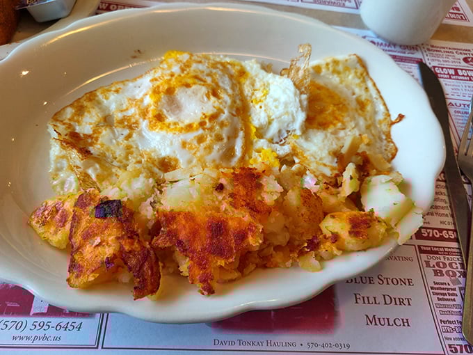 Sunny-side up eggs and golden home fries—a breakfast duet that never disappoints. The crispy potatoes alone are worth the drive through Pocono Mountain roads.