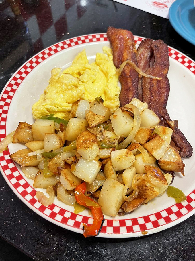 Breakfast nirvana on a plate. Those home fries are playing the perfect supporting role to eggs that clearly graduated from the school of perfect execution.