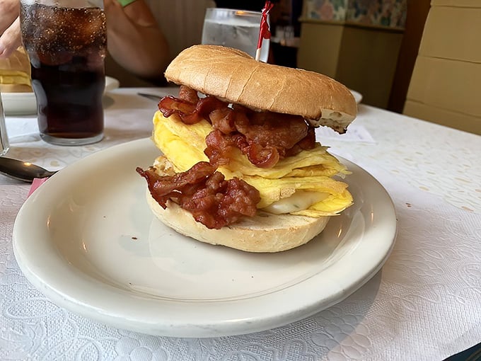 Behold the breakfast sandwich in its natural habitat—where eggs are fluffy, bacon is abundant, and diet plans go to die gloriously.