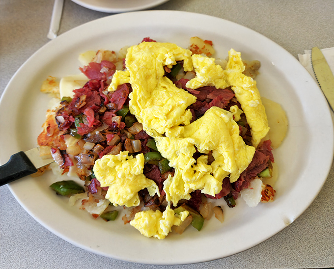 This breakfast skillet doesn't just break the fast – it demolishes it with a harmony of corned beef, crispy potatoes, and eggs that would make Mozart jealous.