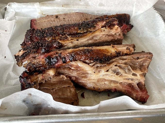Behold: brisket that's spent more time perfecting itself than most of us spend at the gym. That bark! That smoke ring! That's not food – that's art.