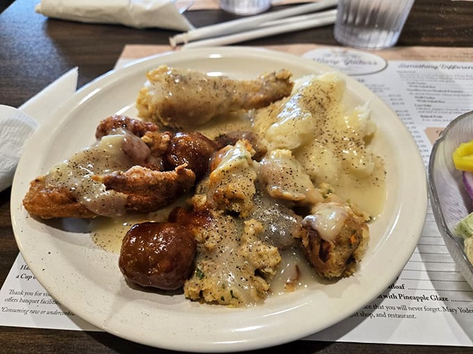 Behold: the plate that launched a thousand food comas. Crispy fried chicken and creamy gravy—a combination that makes diets wave white flags.