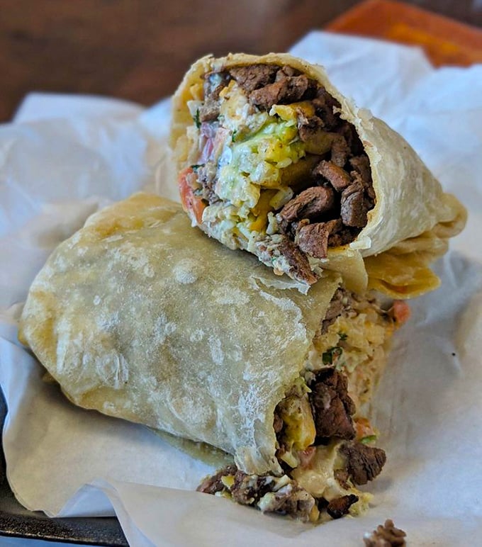 Behold the California burrito in its natural habitat—where french fries and carne asada unite in tortilla-wrapped matrimony that would make any cardiologist nervous.