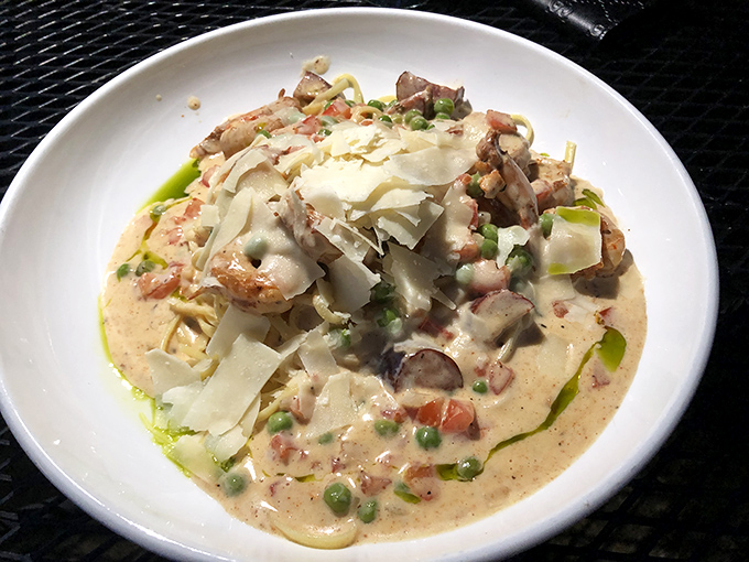 Creamy carbonara that doesn't just speak Italian but sings it with a Southern accent. Those shrimp look like they're having a party in pasta paradise.