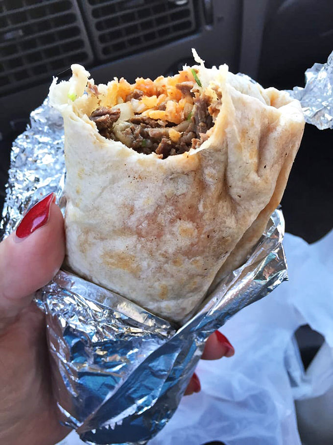 This burrito isn't just wrapped in foil—it's wrapped in dreams. Each bite delivers a perfect meat-to-tortilla ratio that mathematicians envy.