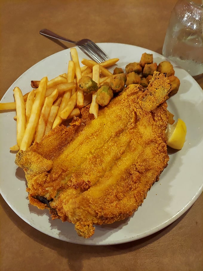 Golden-crusted and perfectly fried, this mountain trout wears its cornmeal coating like a designer outfit – simple, elegant, and making everything else on the plate look better.