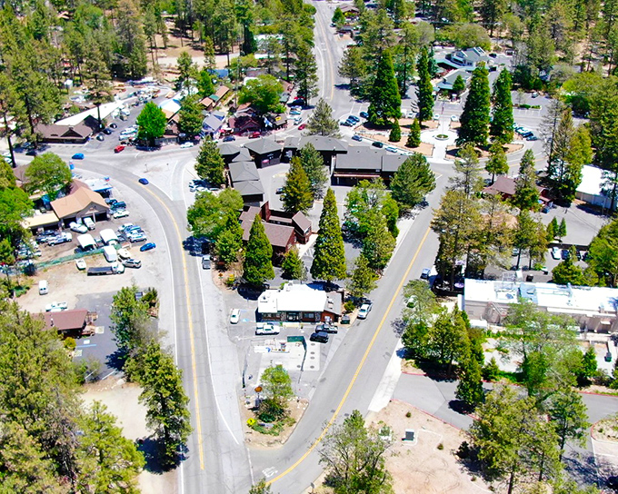 Bird's eye view of Idyllwild's village center, where roads curve through the pines like ribbons tying together this perfect mountain package.