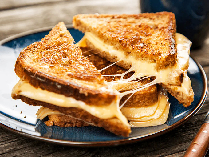 Behold, the grilled cheese of your dreams—where the cheese pull requires a building permit. Comfort food engineering at its finest.