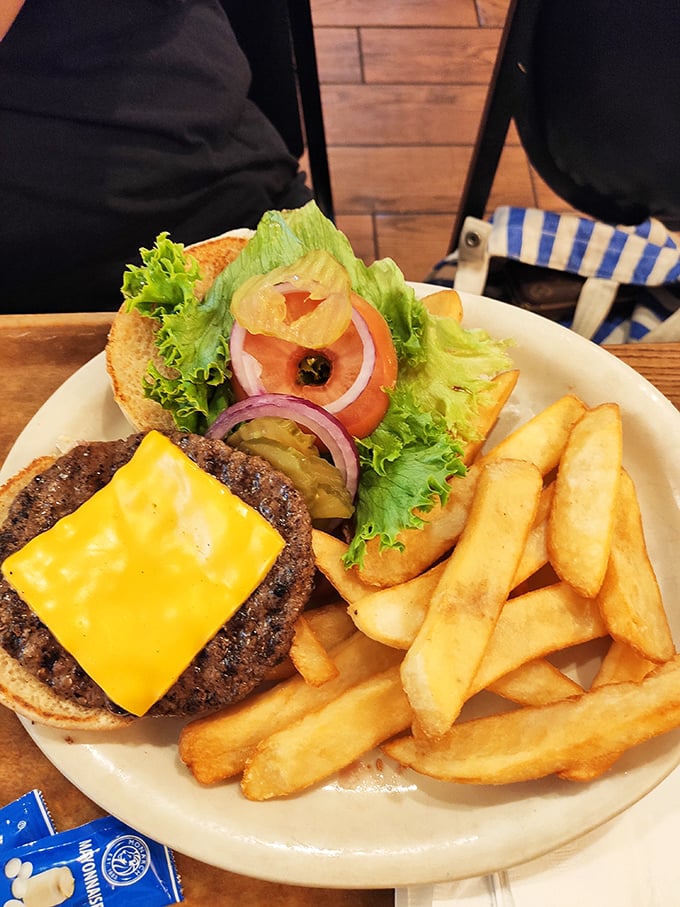 This isn't just a cheeseburger—it's a juicy manifesto on a bun that reminds you why simple food done right trumps fancy cuisine every time.