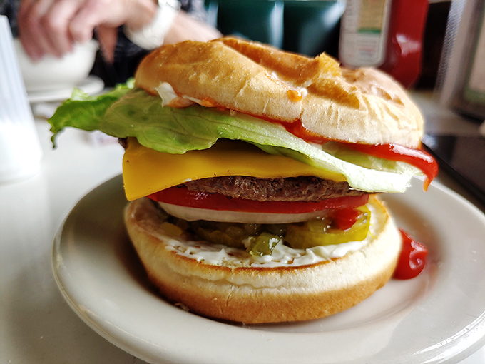 This isn't just a cheeseburger—it's edible architecture with layers of flavor that would make Frank Lloyd Wright jealous.