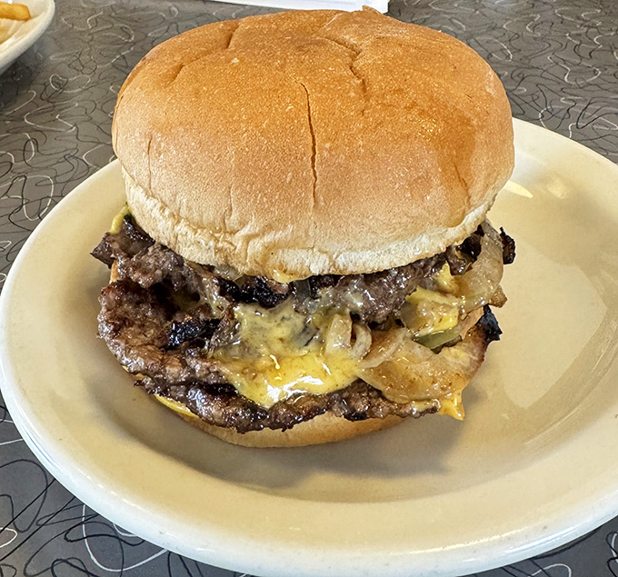 This double cheeseburger isn't trying to reinvent the wheel—it's simply perfecting it. Melted cheese cascades over caramelized patties like a savory waterfall.