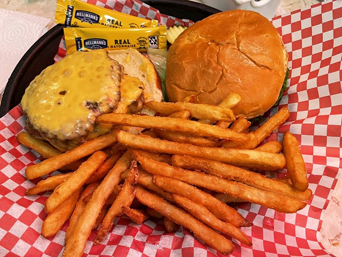 This isn't just a cheeseburger—it's comfort on a plate, with fries so golden they deserve their own trophy.