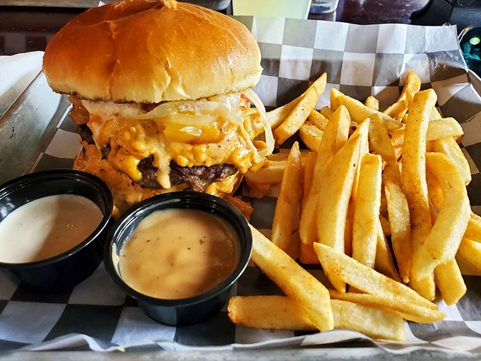 Cheese cascading down the burger like Niagara Falls, with fries standing by for the inevitable sauce overflow situation.