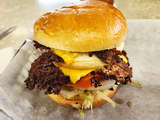 The legendary lacy-edged burger that launched a thousand food pilgrimages. That crispy cheese skirt is the superhero cape this sandwich deserves