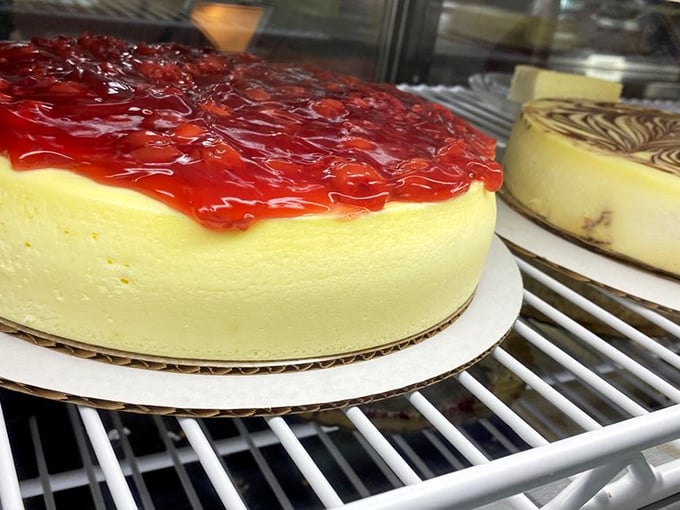 Cheesecake that would make the Golden Girls drop everything and drive to Pennsylvania. That ruby-red topping isn't just pretty—it's calling your name.