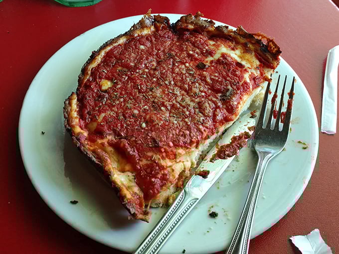 Chicago-style pizza that makes New Yorkers question their life choices. That darkened crust isn't burnt – it's flavor transformed into art.