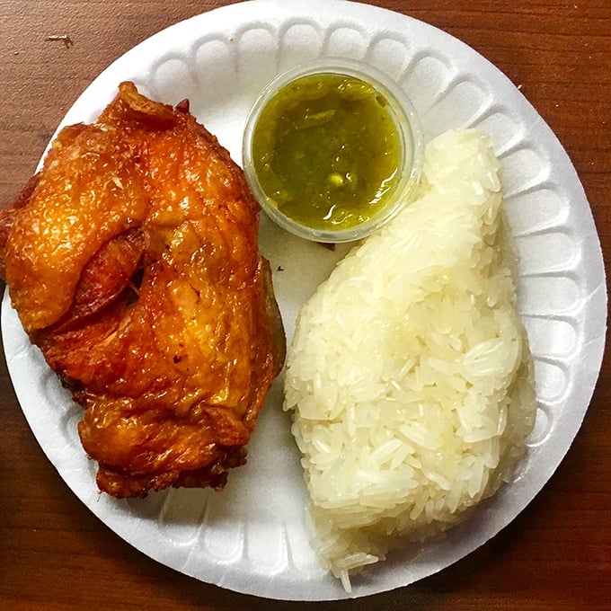 Behold the headliner: gloriously caramelized chicken alongside a mountain of pristine rice, with that green sauce standing by like a flavor superhero ready to save your day.