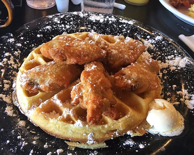 
Chicken and waffles: where Southern comfort meets Midwestern hospitality. That powdered sugar dusting isn't decoration—it's a blessing from the breakfast gods.