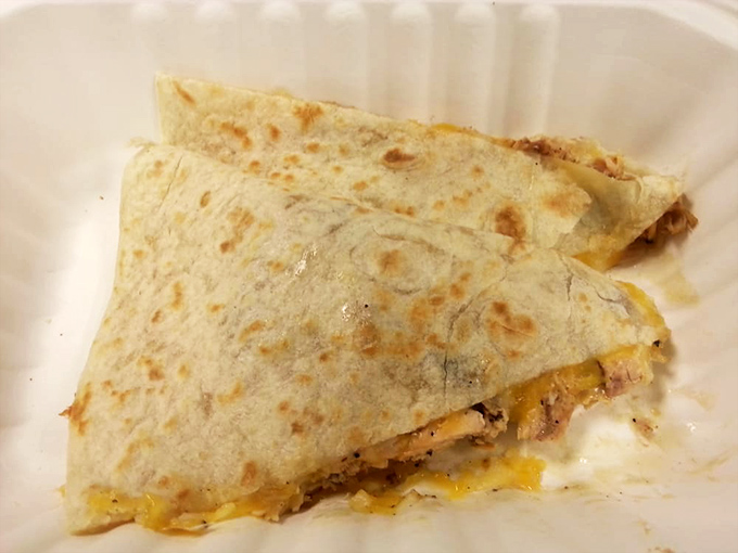 Quesadilla perfection that would make abuelitas nod in approval. Crispy exterior, melty interior – the universal language of comfort food.