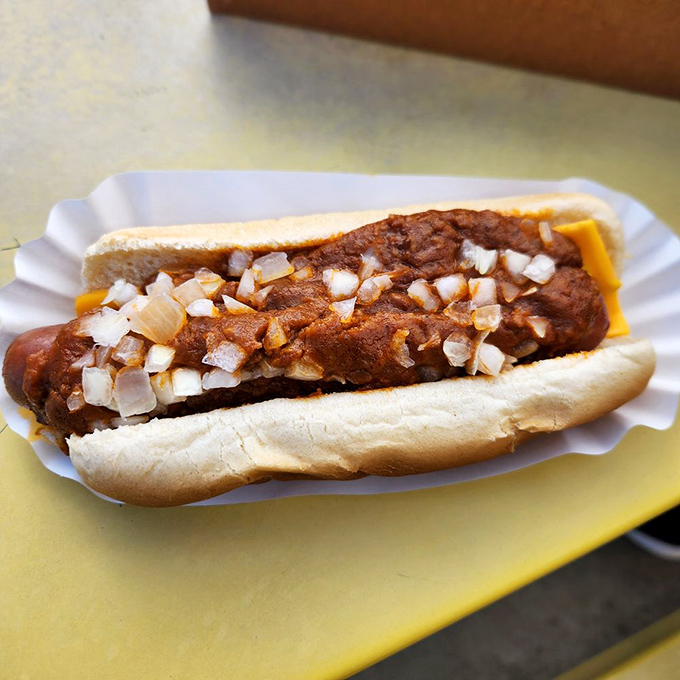 This isn't just a chili dog—it's a masterclass in simplicity, where every diced onion piece plays a crucial supporting role.