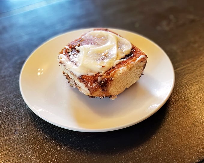 This isn't just a cinnamon roll—it's edible architecture, a spiral of buttery perfection that makes you wonder why you ever settled for less.