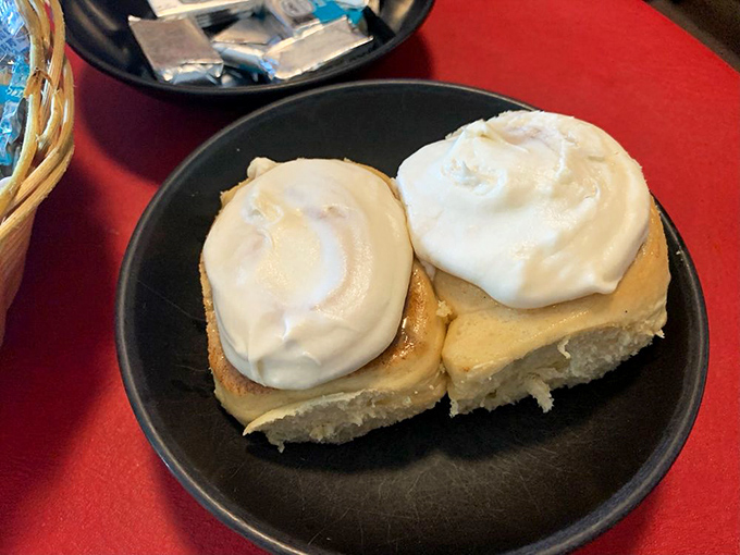 These cinnamon rolls aren't just dessert, they're an edible hug—pillowy soft centers with cream cheese frosting melting into every warm crevice.
