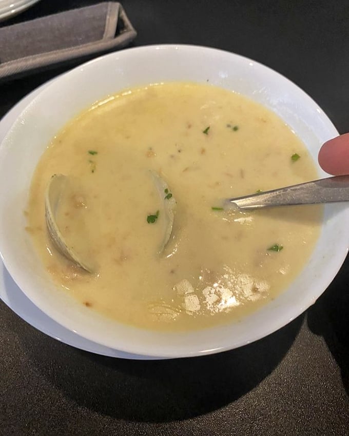 The legendary clam chowder arrives like a creamy cloud from seafood heaven—each spoonful a perfect marriage of briny clams and velvety broth.